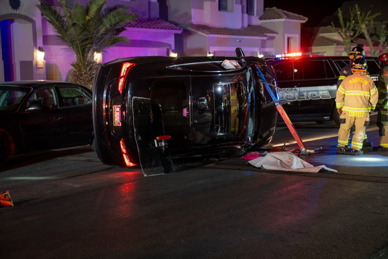 Neighbors stunned after car lands on its side on quiet Meadows street ...